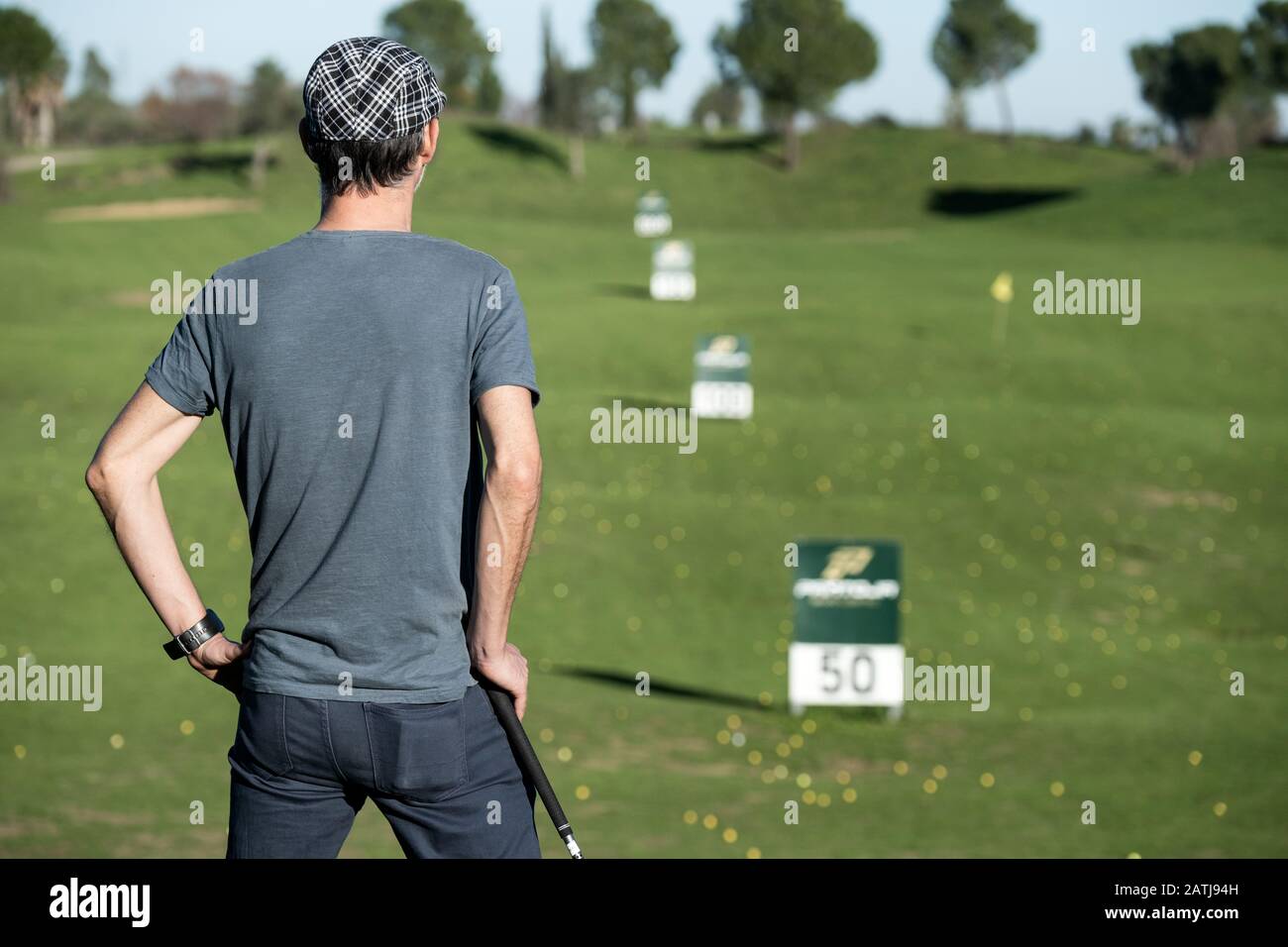 golfer on his back leaning on a golf club looking at the horizon Stock ...