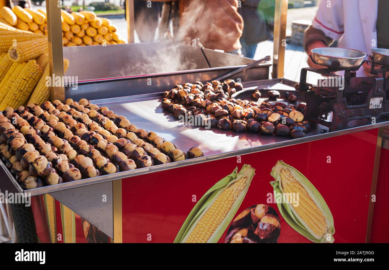 Traditional street food grilled chesnuts Stock Photo - Alamy