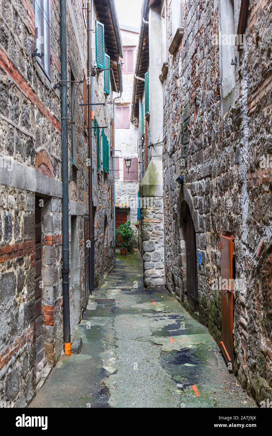 Narrow alley in an old neighborhood Stock Photo - Alamy
