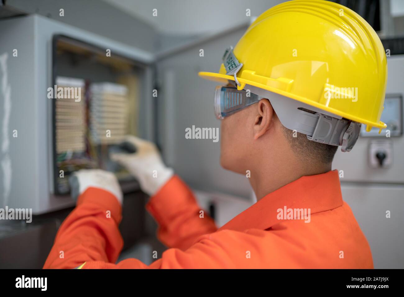Technicians are checking the telephone line system in the building ...