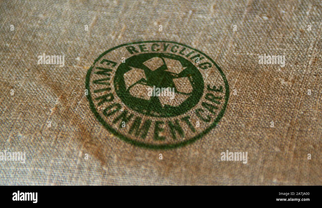 Recycling stamp printed on linen sack. Recycle symbol, arrows ...