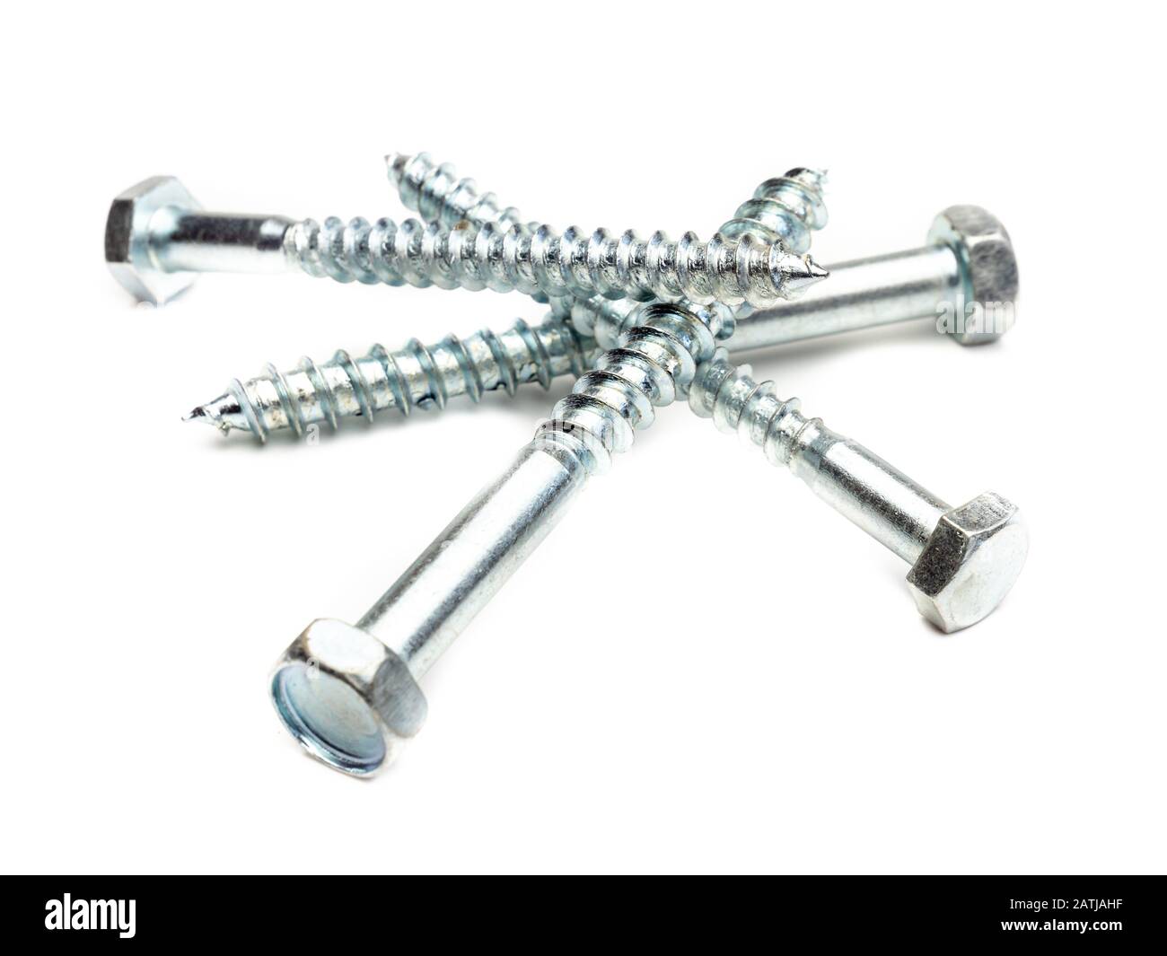 Large steel screws on white background Stock Photo - Alamy