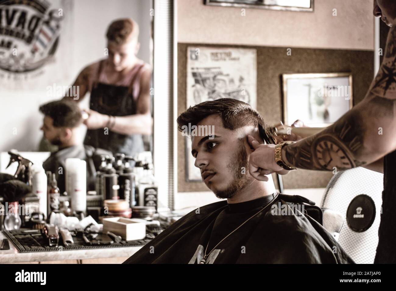 Man having haircut in barbershop Stock Photo - Alamy