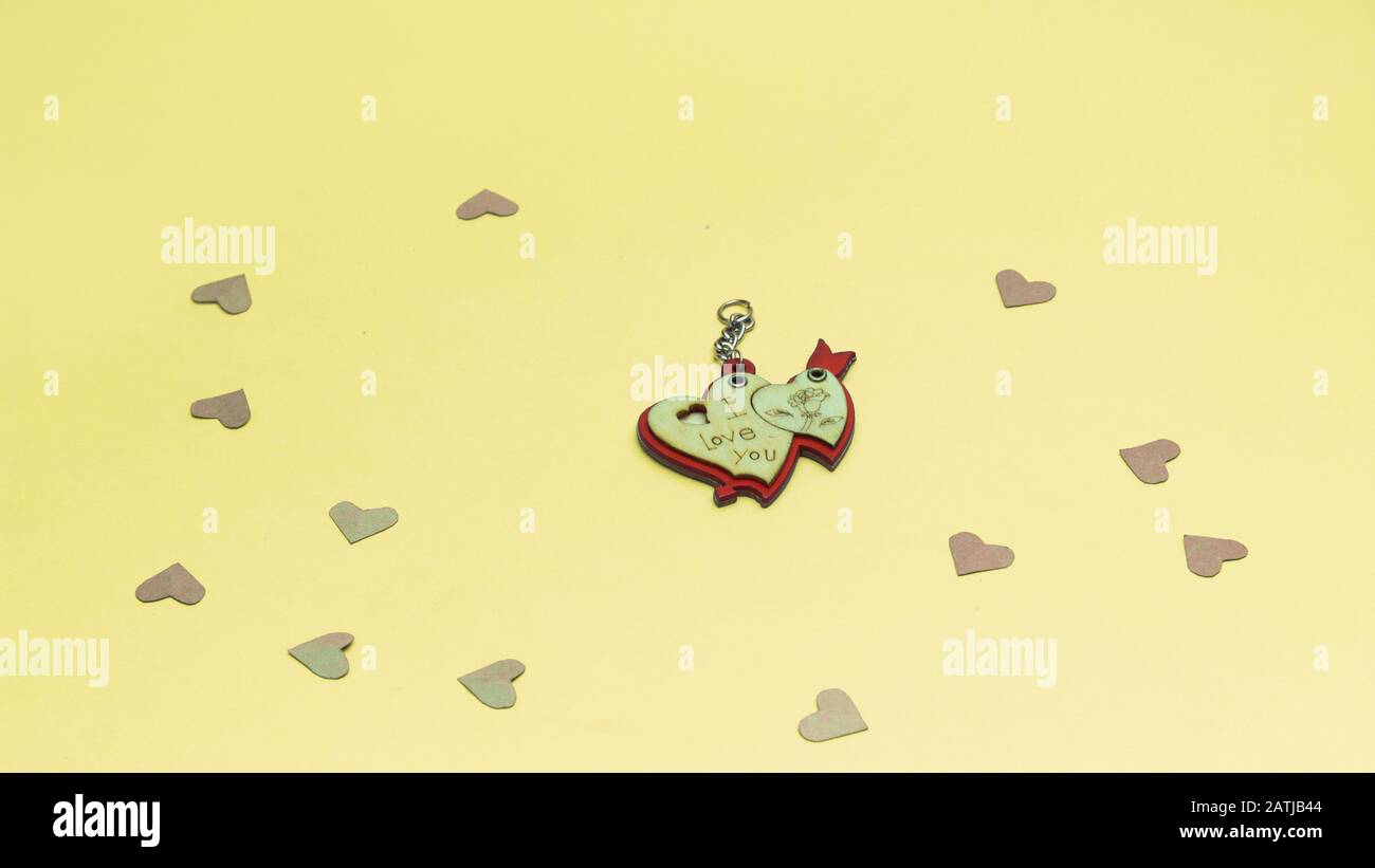 Heart shape key chain with heart shape chart on yellow background Stock ...