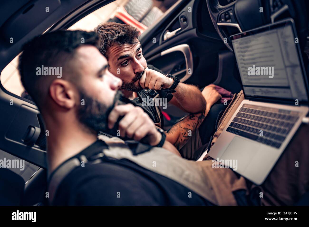 Car diagnostic.Mechanics using laptop on car at repair garage Stock ...