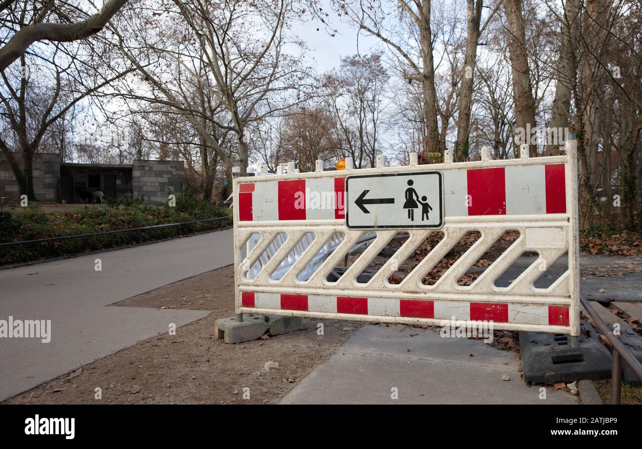 Repair of pedestrian footpath, direction to the left Stock Photo - Alamy