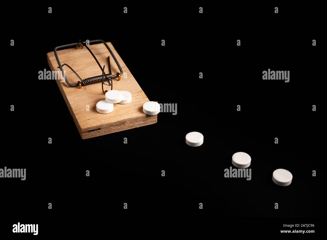 Mousetrap with bait in the form of a tablets. Stock Photo Addiction ...