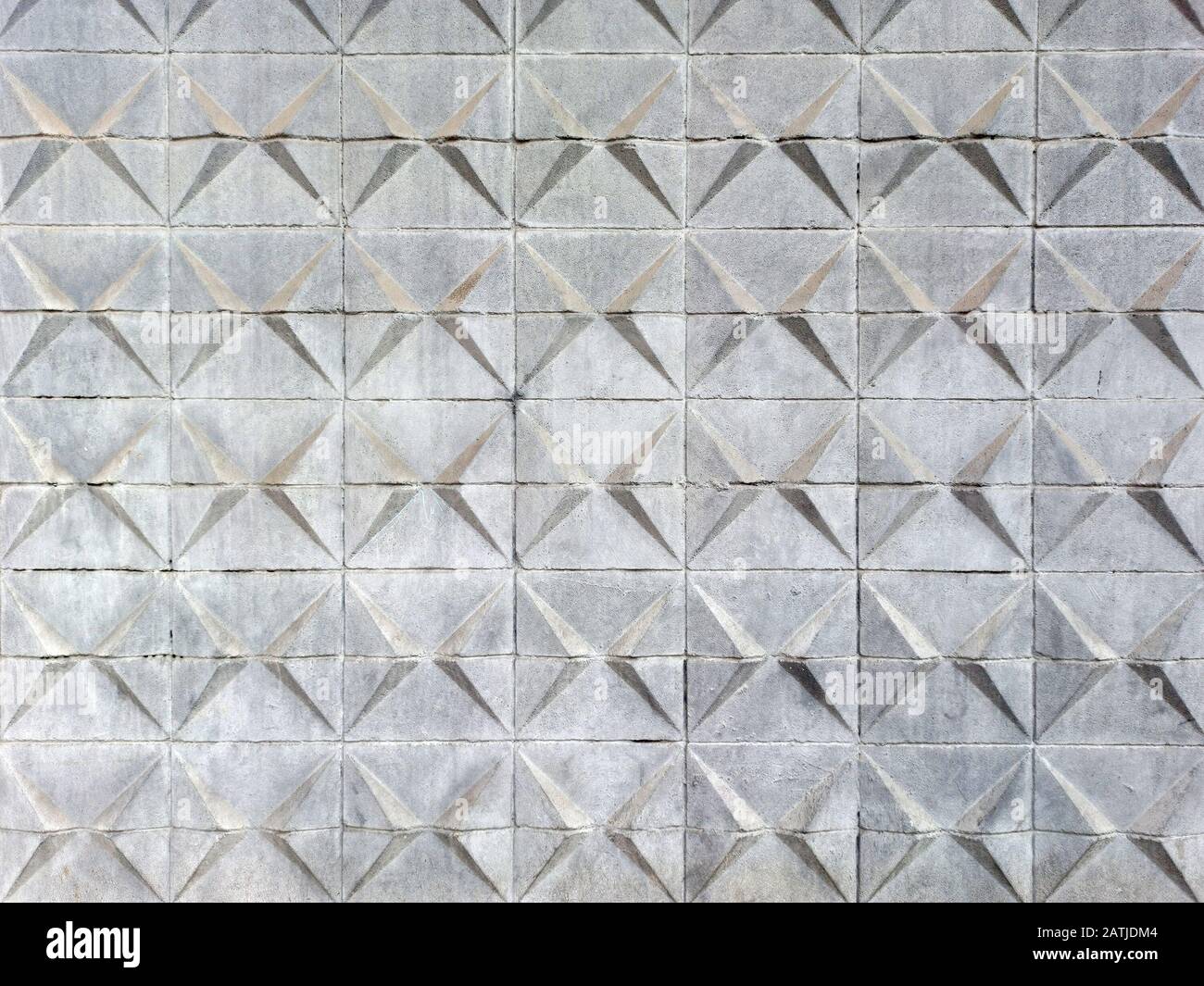 Concrete wall with geometric pattern backdrop Stock Photo - Alamy