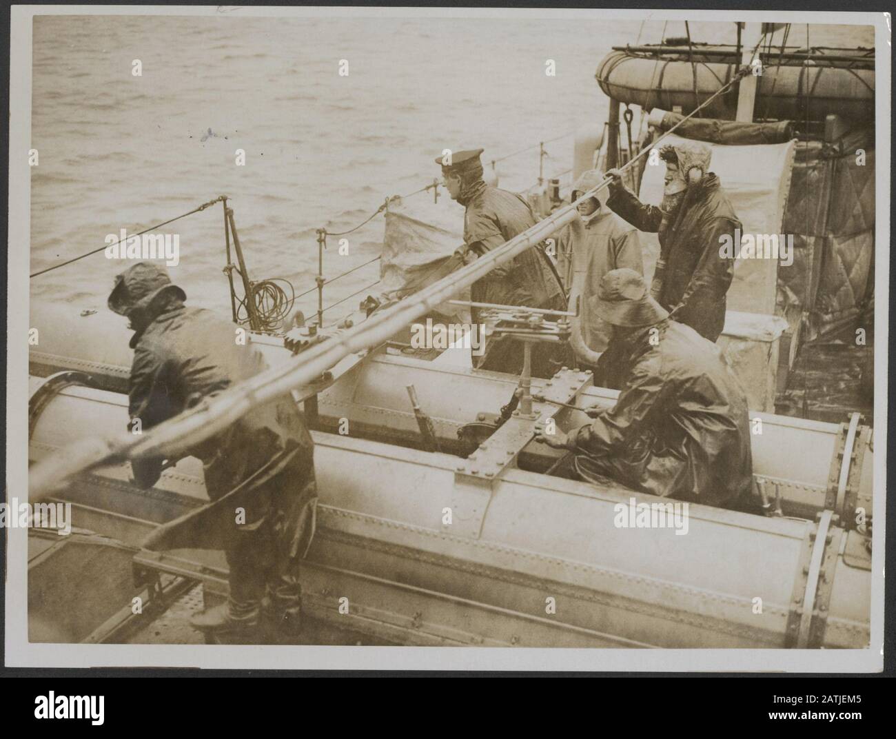 With the British navy in war time Description: Firing a torpedo from a ...