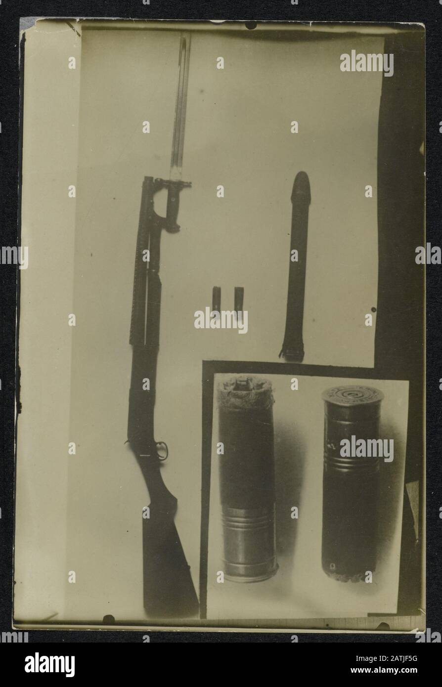 Description: Rifle with bayonet and used bullet casings Date: {1914 ...