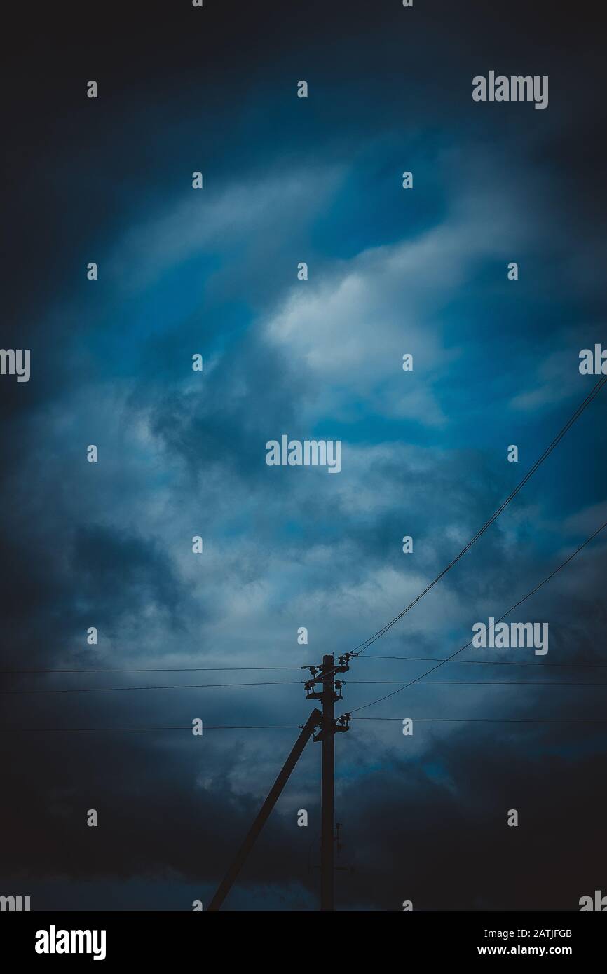 Dark clouds electric pole hi-res stock photography and images - Alamy