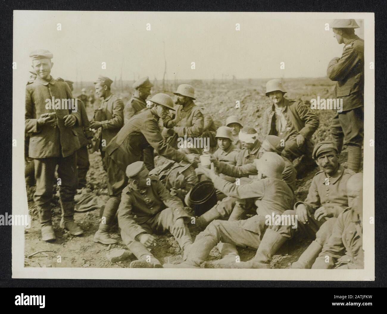 Canadian official photographs description: Handing over a drink to some ...