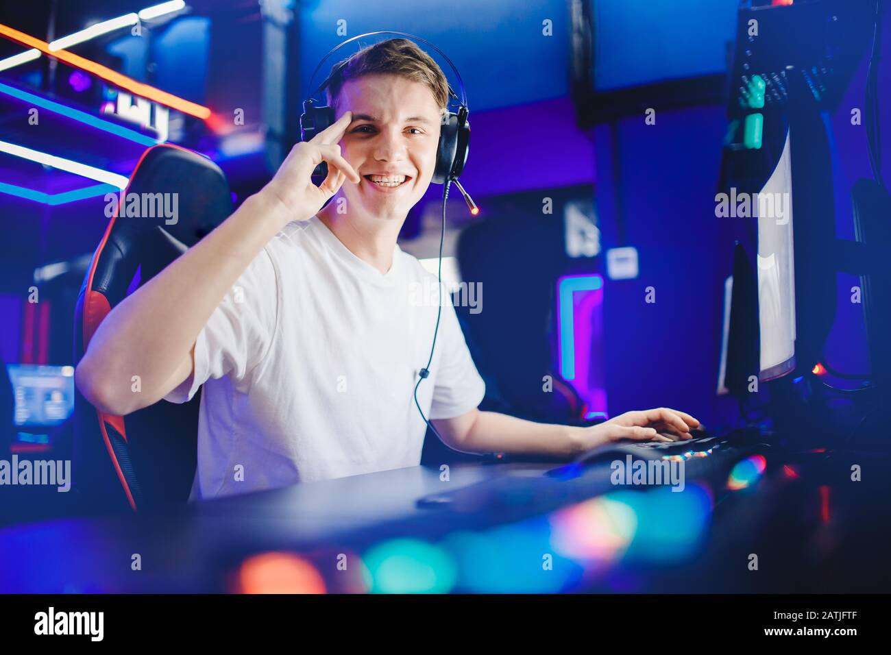 Professional gamer playing tournaments online video games computer with ...
