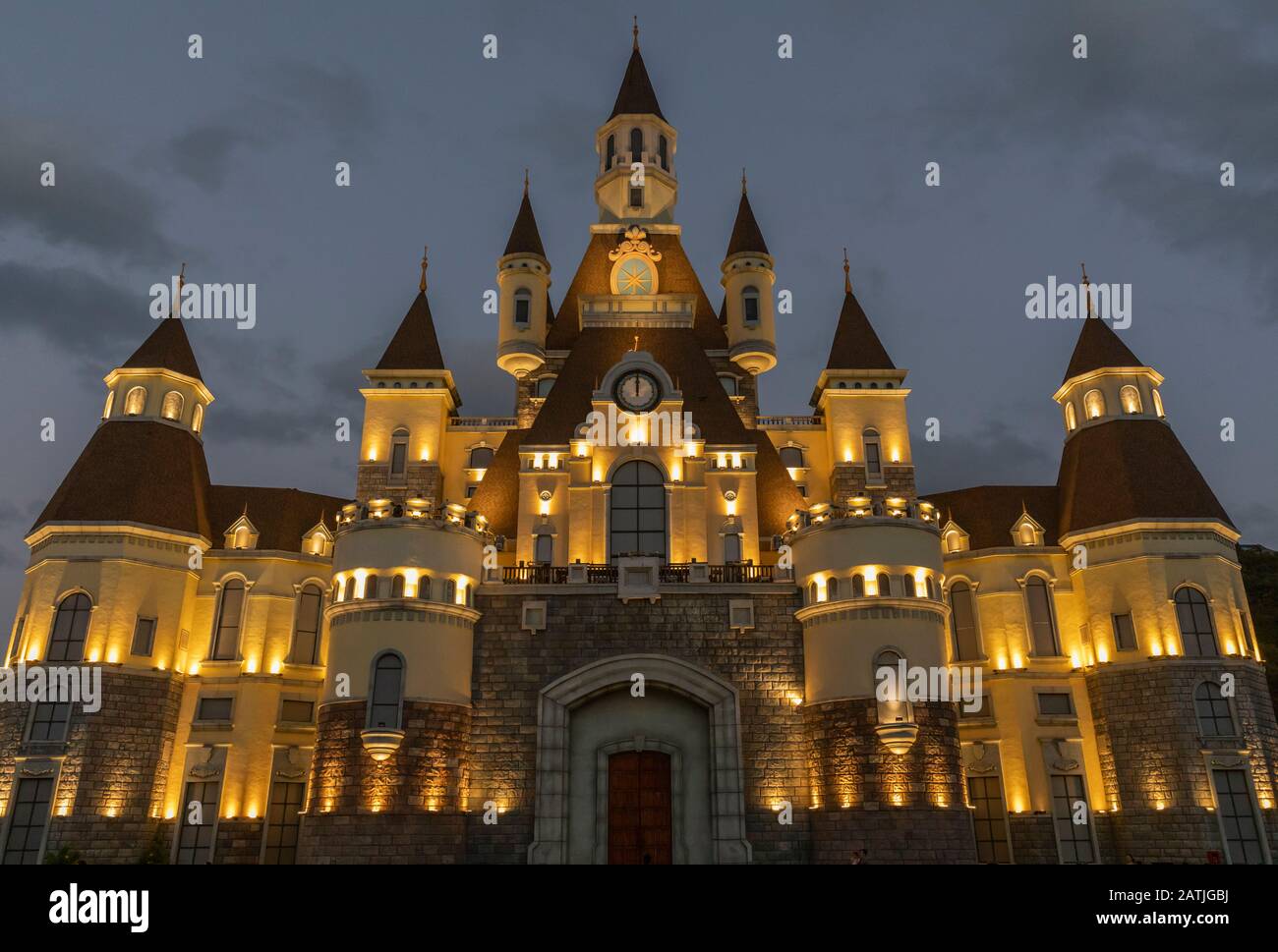Beautiful gothic castle styled building with towers in late afternoon ...