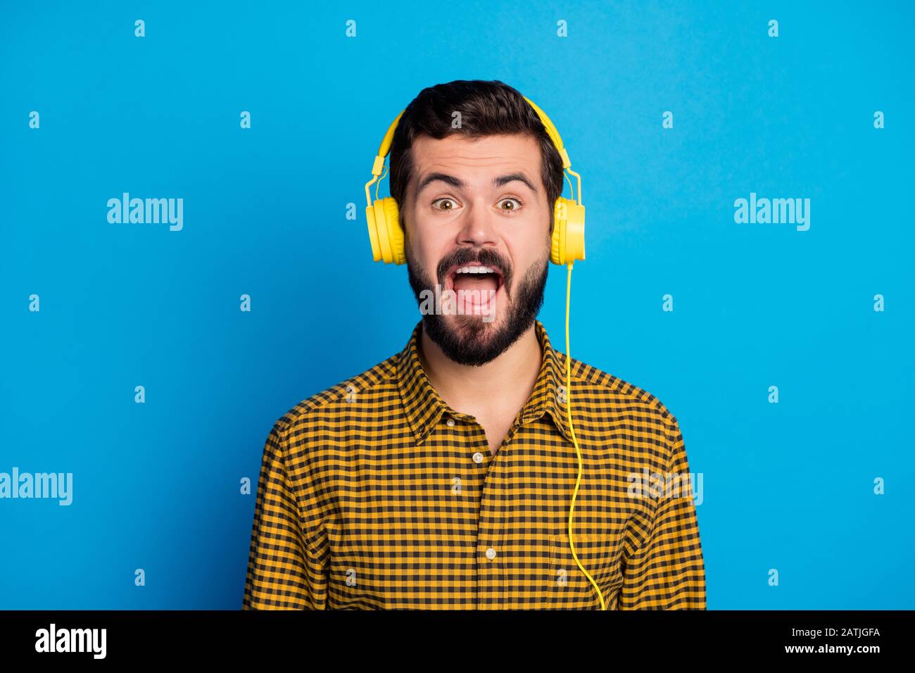 Portrait of excited enthusiastic guy listen radio music find his ...