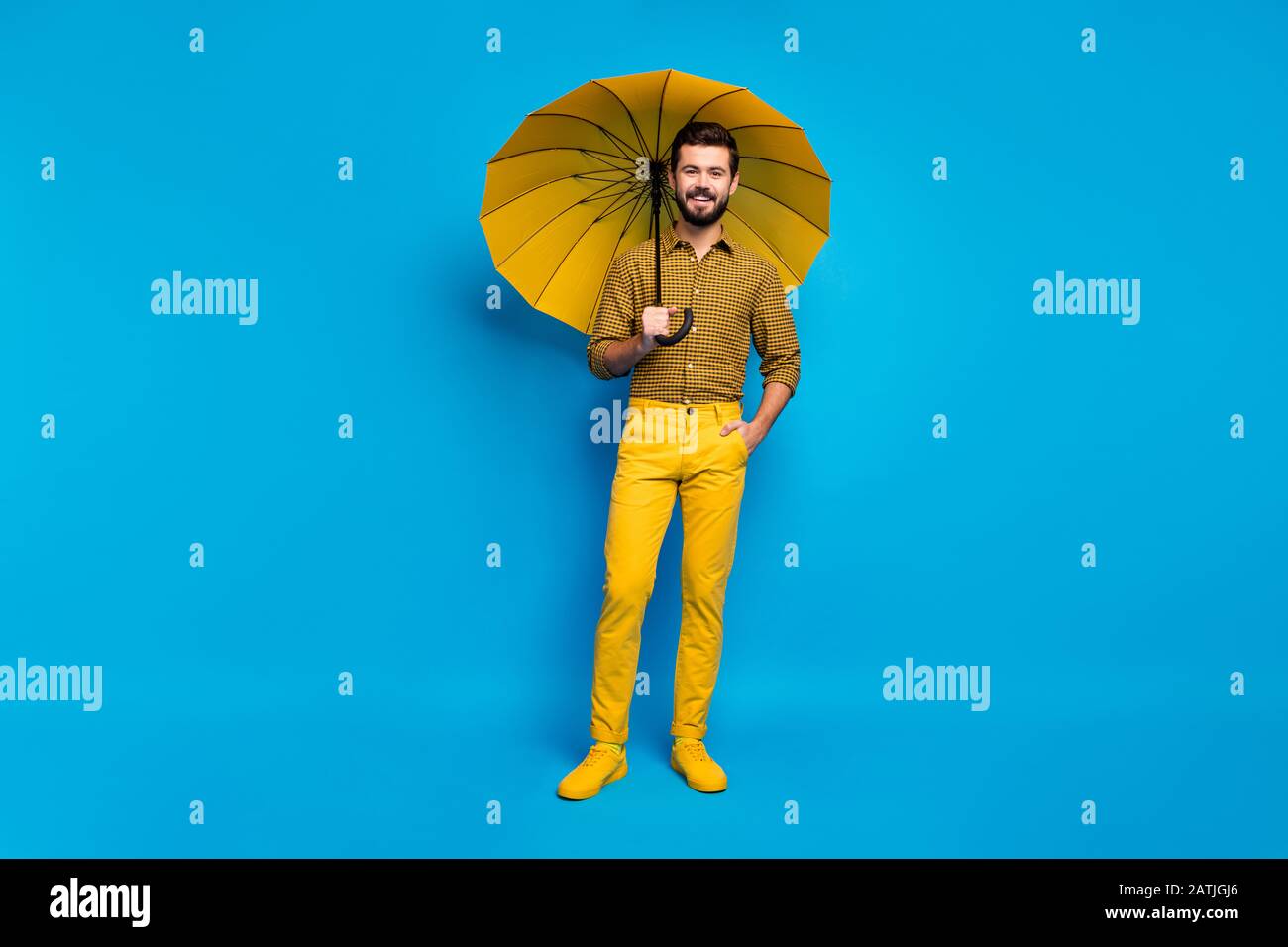 Full body photo of cheerful dreamy energetic guy fun free time on rainy ...
