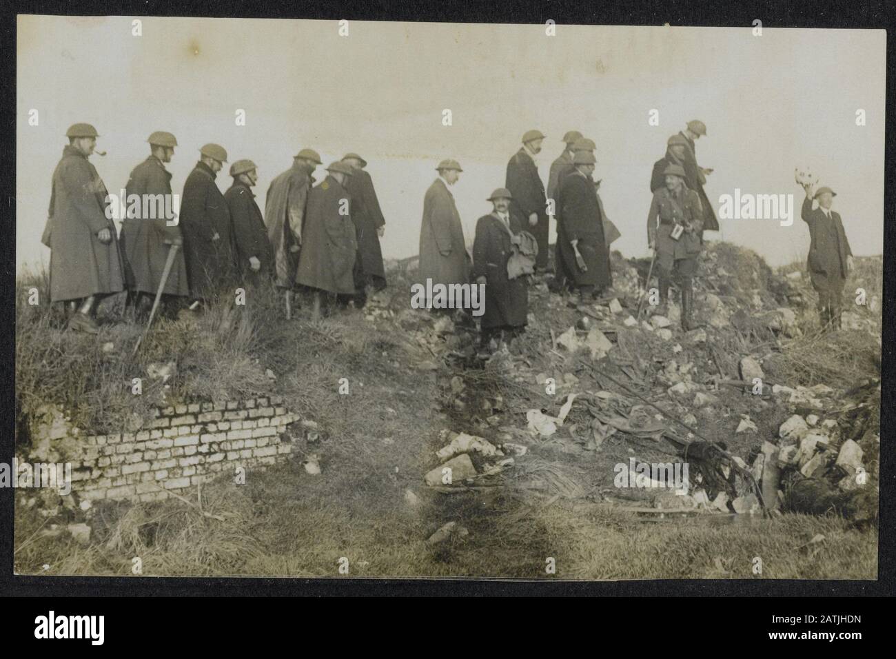 Description: Soldiers and civilians visiting a battle line where once ...