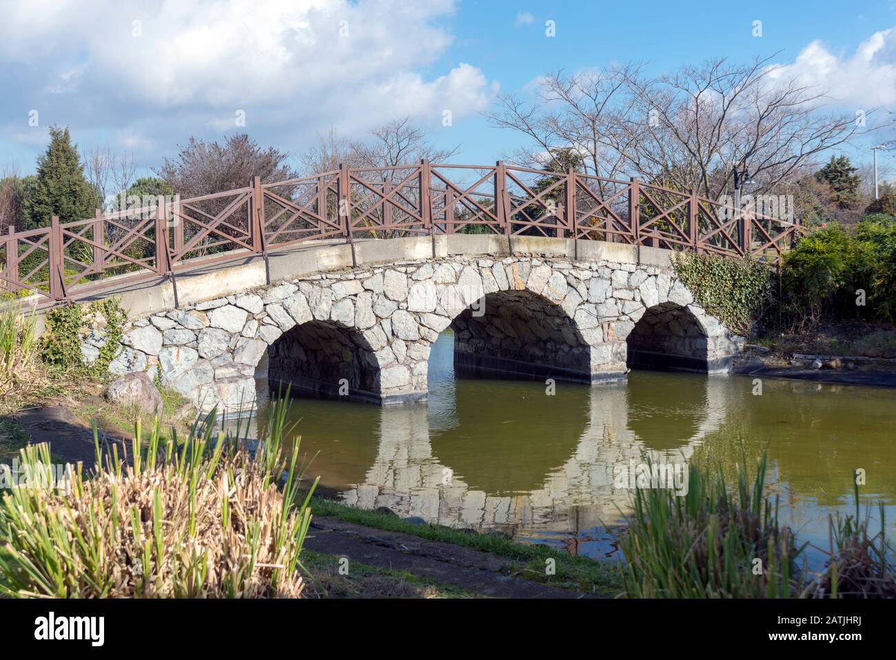 Bridge in city park with beautiful scenery Stock Photo - Alamy