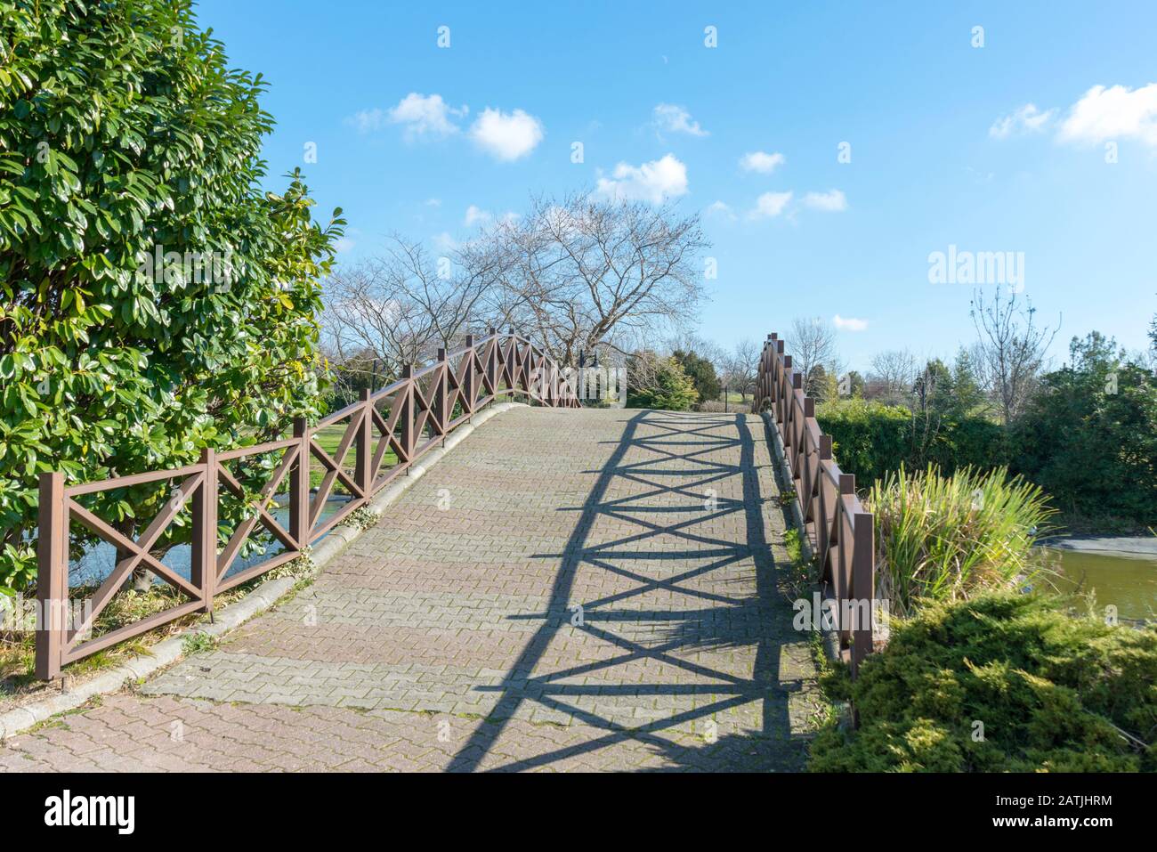Bridge in city park with beautiful scenery Stock Photo - Alamy