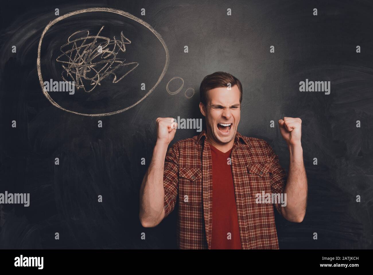 Young man with mess in head yelling and screaming Stock Photo - Alamy