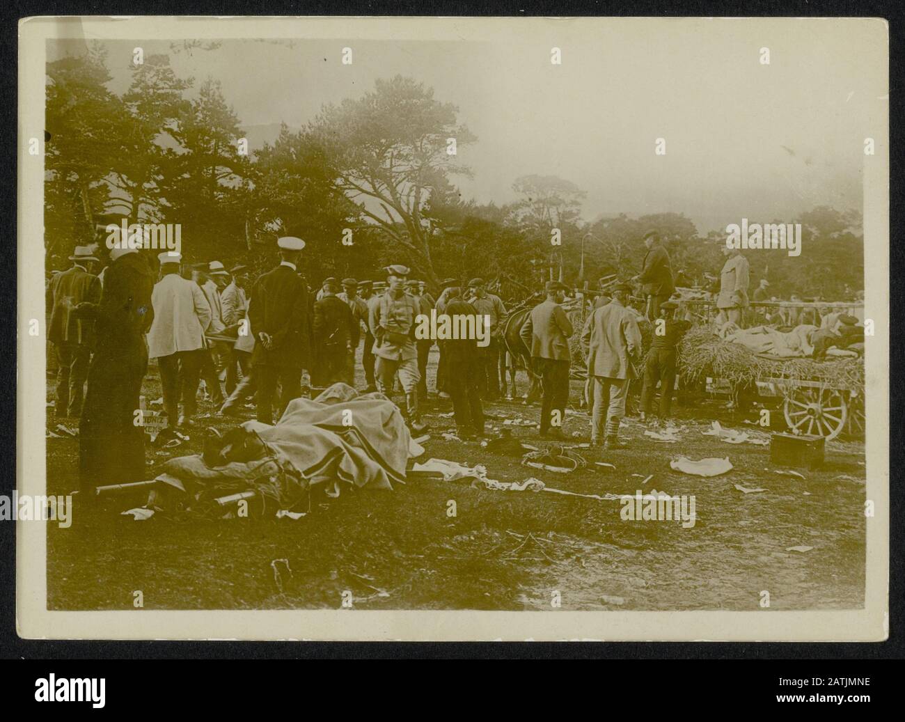 Description: Scene behind the front with wounded soldiers and civilians ...