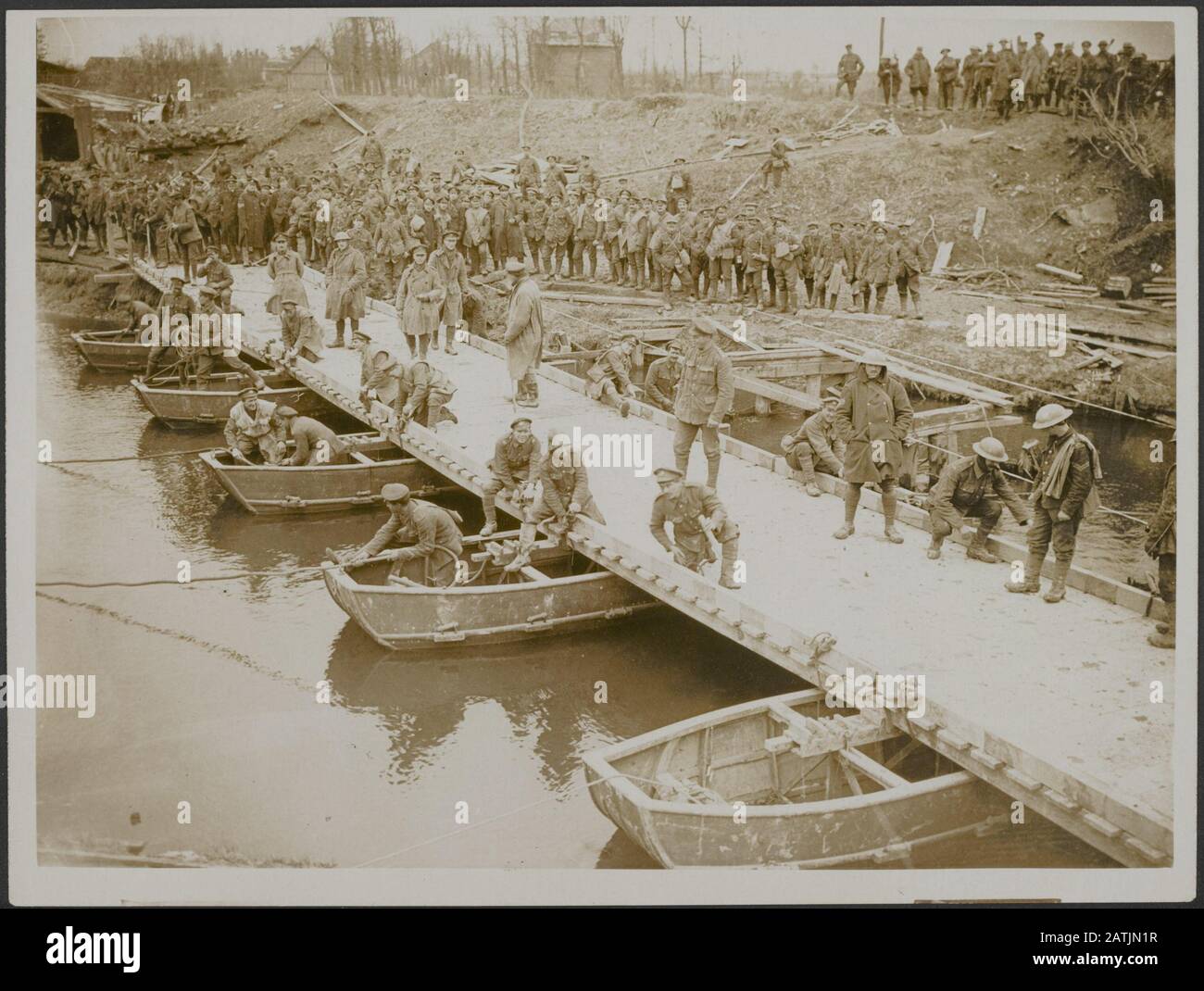 Description: THE BRITISH WESTERN FRONT. Building a pontoon bridge in ...