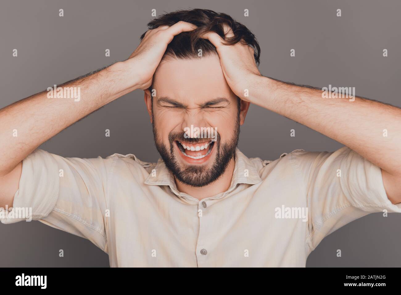 Frustrated angry man with big problems yelling and touching head Stock ...