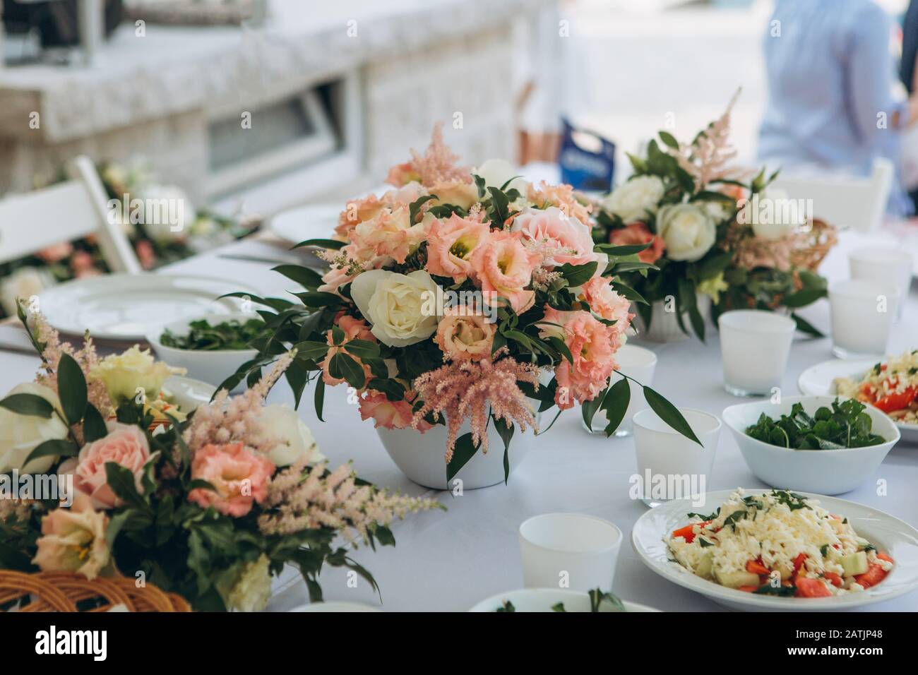 Decoration of flowers on the table with various food or snacks ...