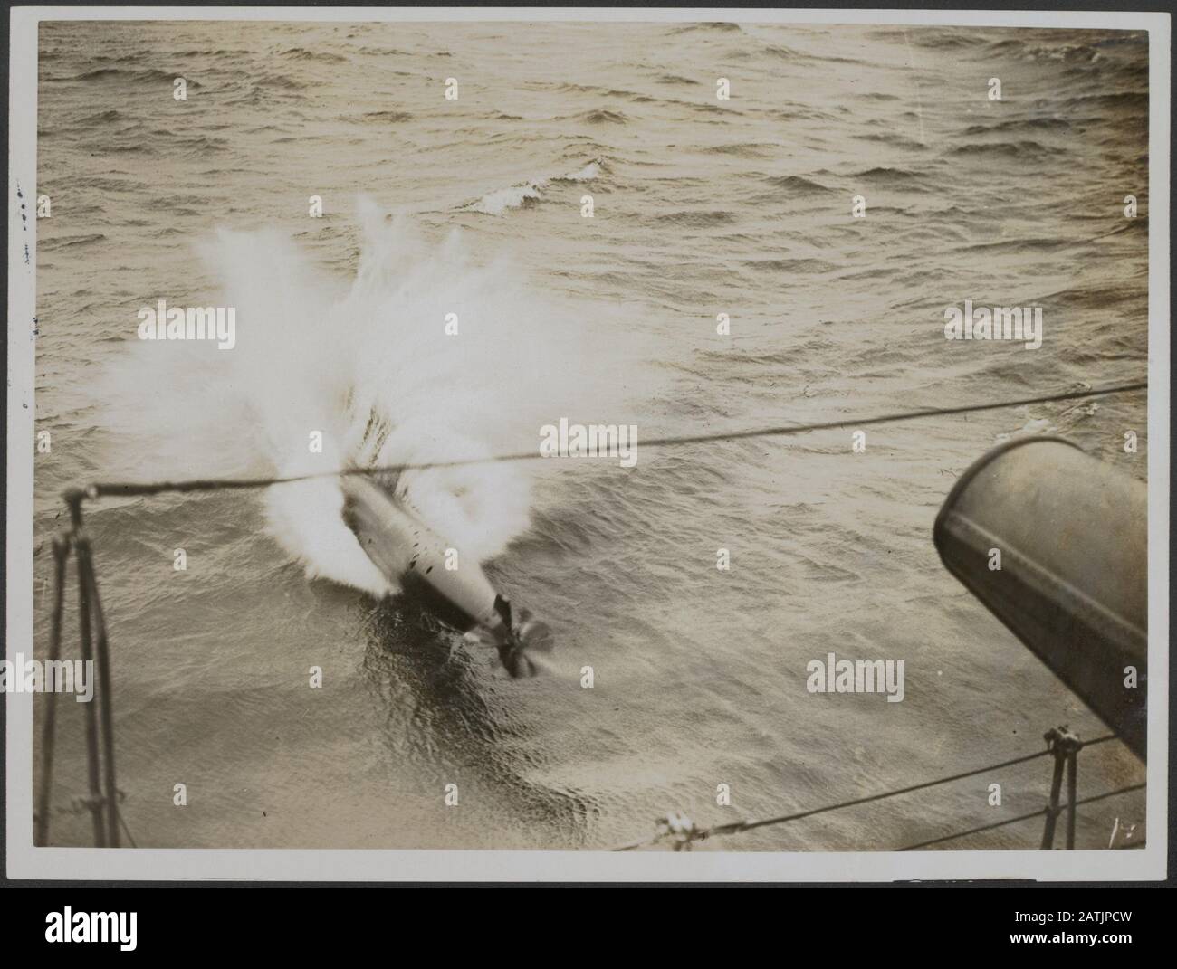 With the British navy in war time Description: Torpedo entering water ...