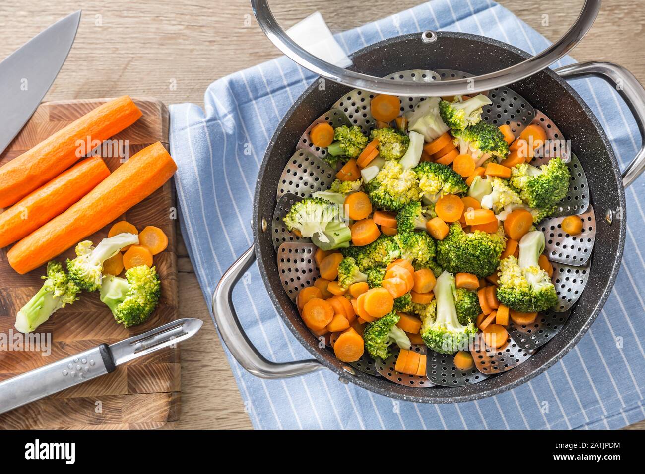 Steamed mixed vegetable in black pot. Healthy vegetable concept Stock ...