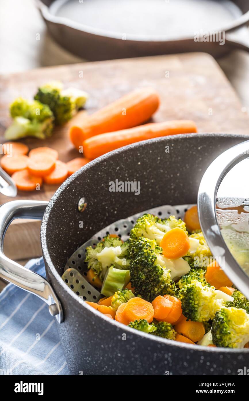 Steamed mixed vegetable in black pot. Healthy vegetable concept Stock ...