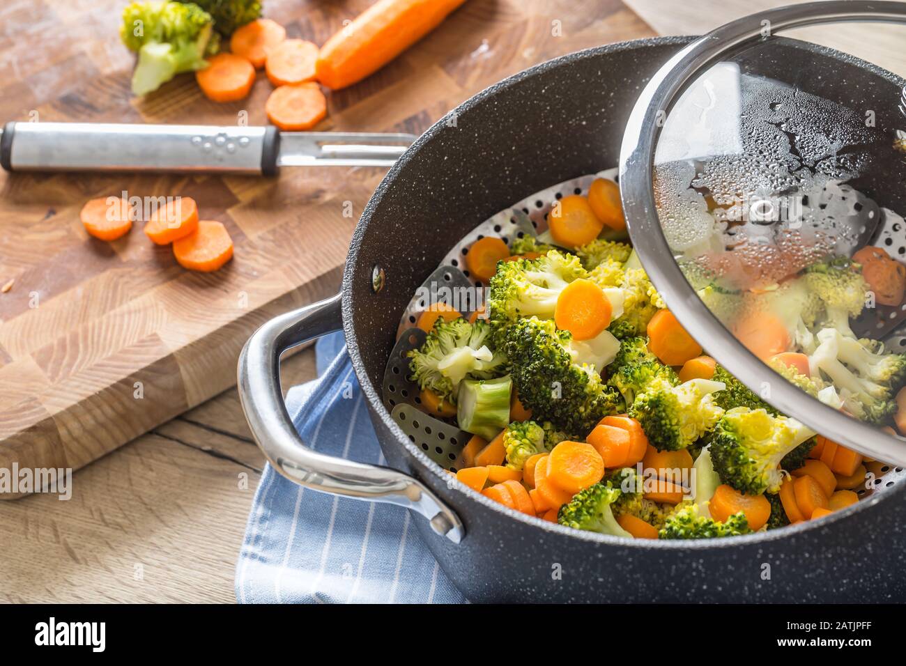 Steamed mixed vegetable in black pot. Healthy vegetable concept Stock ...