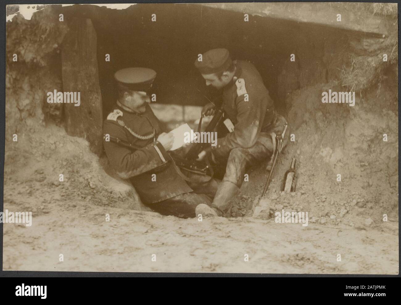 Description: Two soldiers produce in a shelter Date: {1914-1918 ...