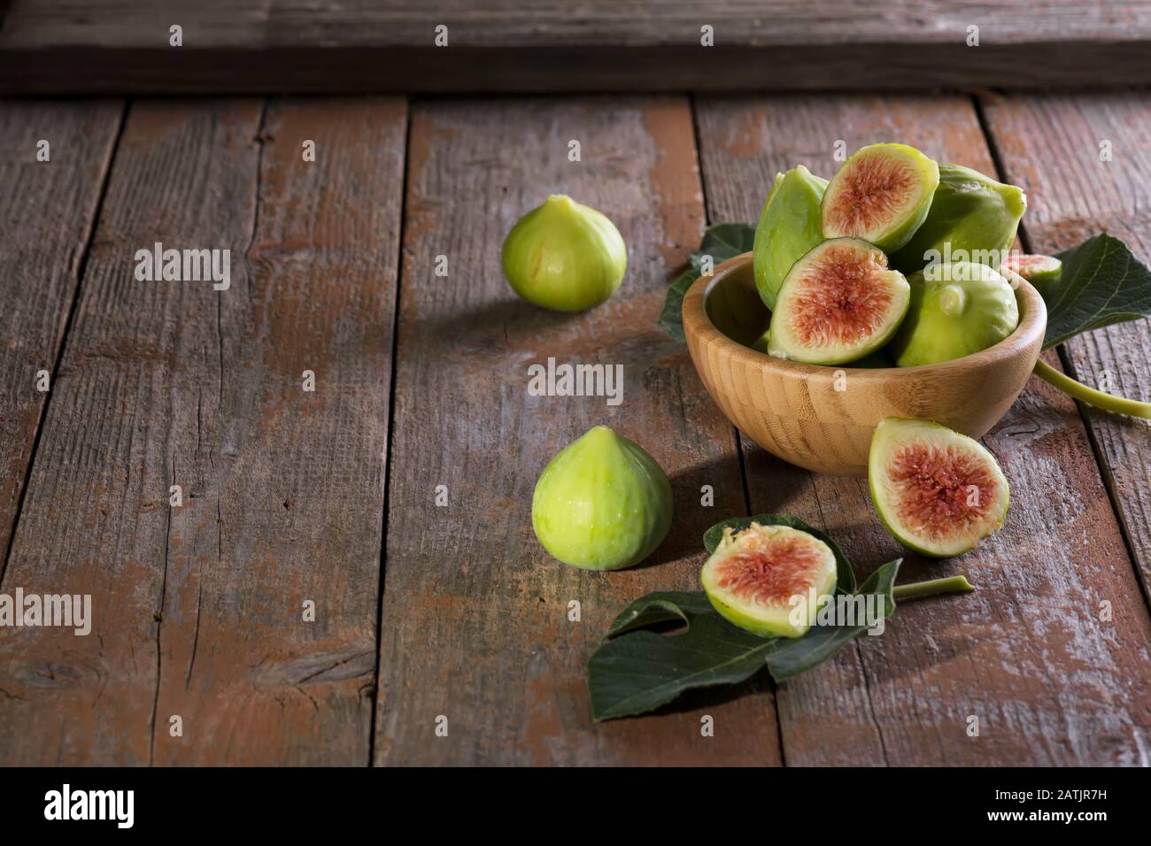 Ripe sweet green figs with green leaves. Healthy mediterranean fig ...