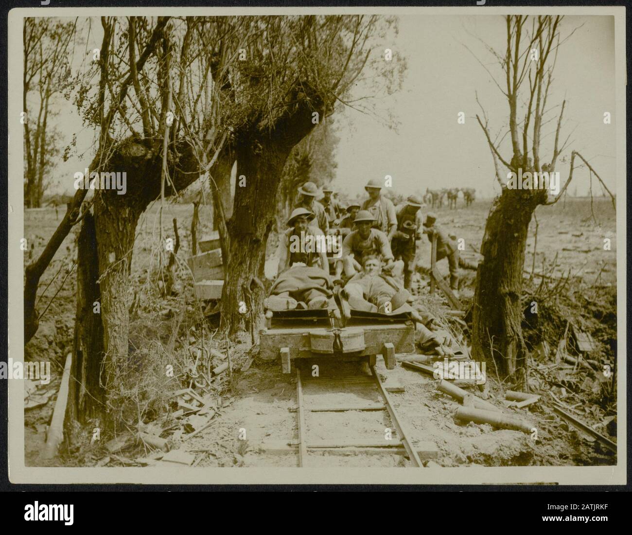 The Western Front Description: Wounded coming along in a light railway ...