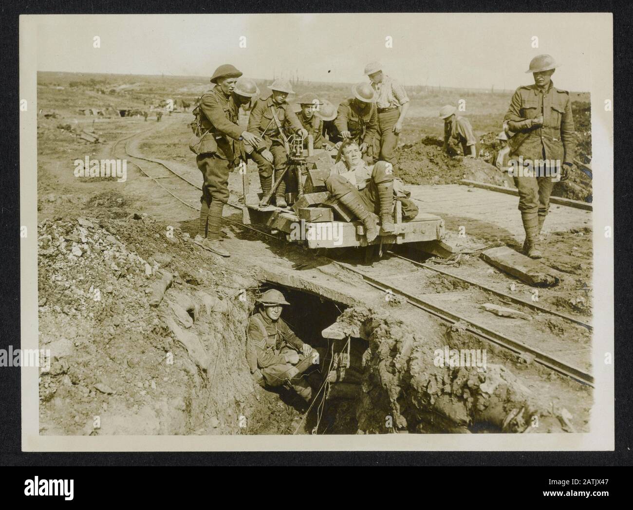 With the Canadians in the great battle Description: Bringing in a ...