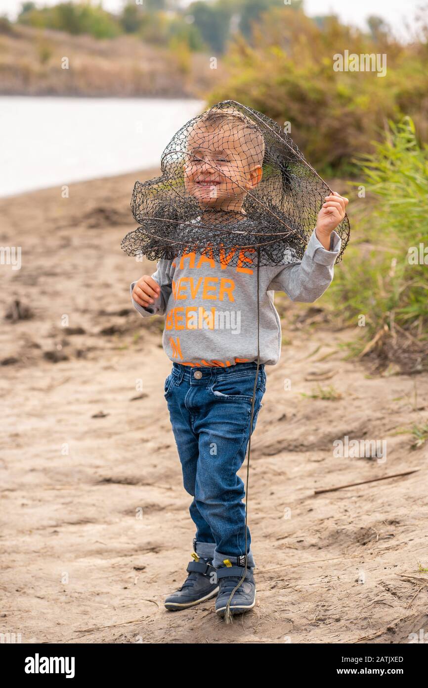 Boy with a net on his head hi-res stock photography and images - Alamy