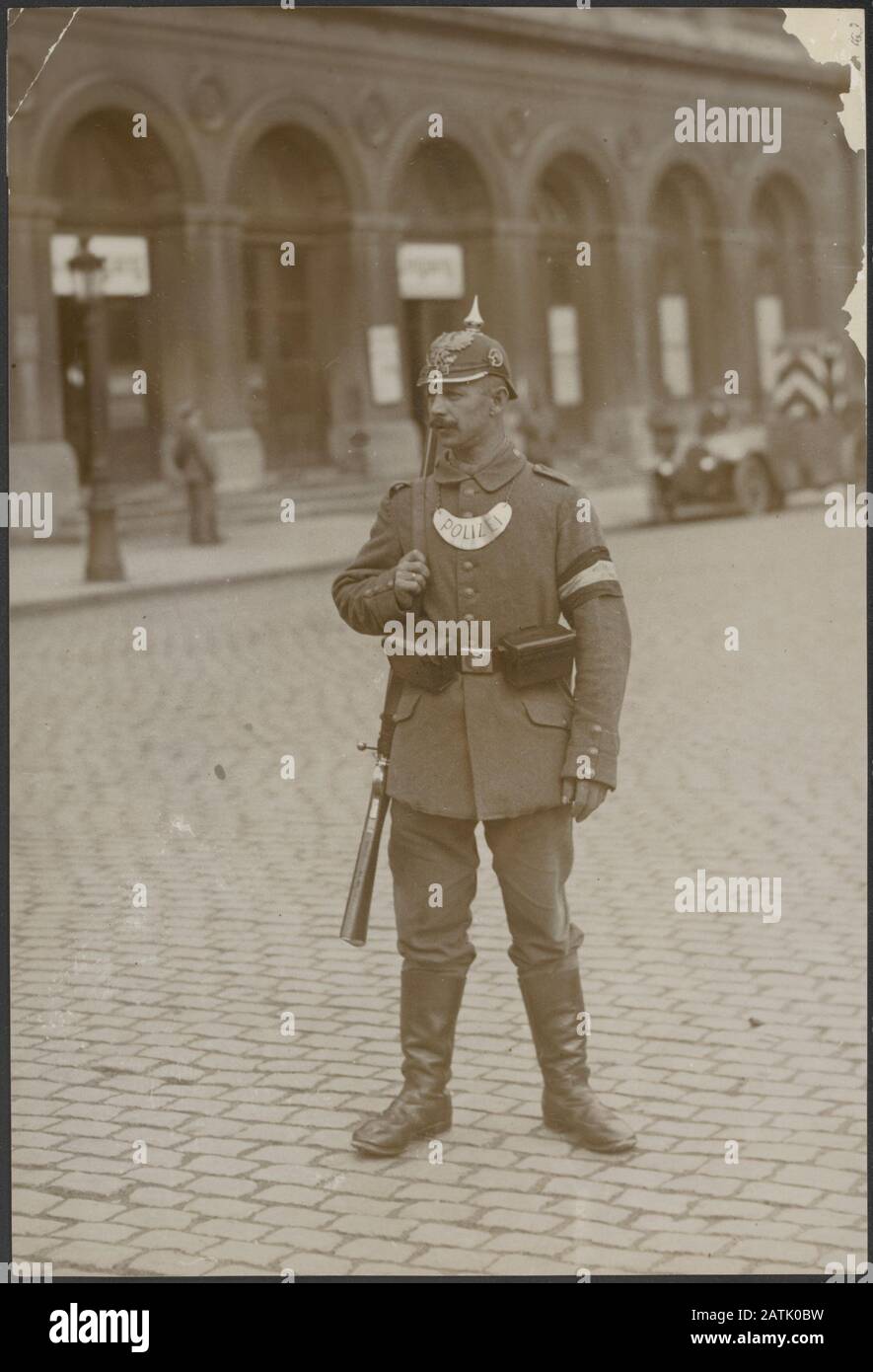 Description: German policeman on a square in front of a building. Date ...