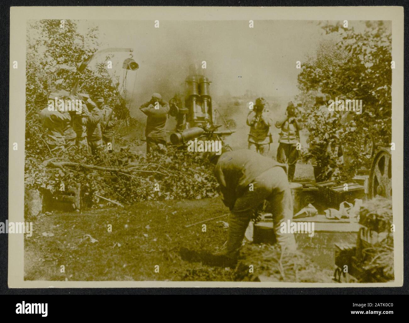 Description: German soldiers protect their ears against the noise when ...