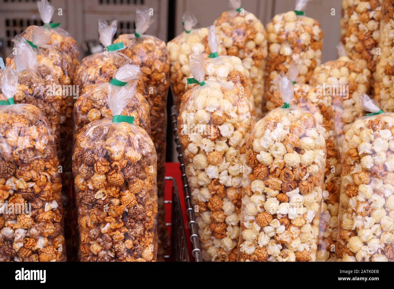 Popcorn stall at the stadium. Different types of popcorn: kettle ...