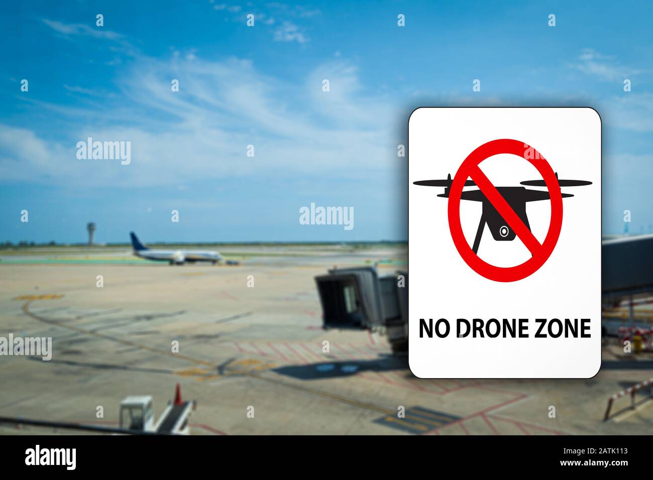 No drone flying warning sign witha generic airport blurred background ...