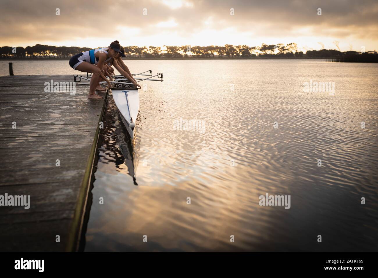 Female rowing team training on a river Stock Photo - Alamy