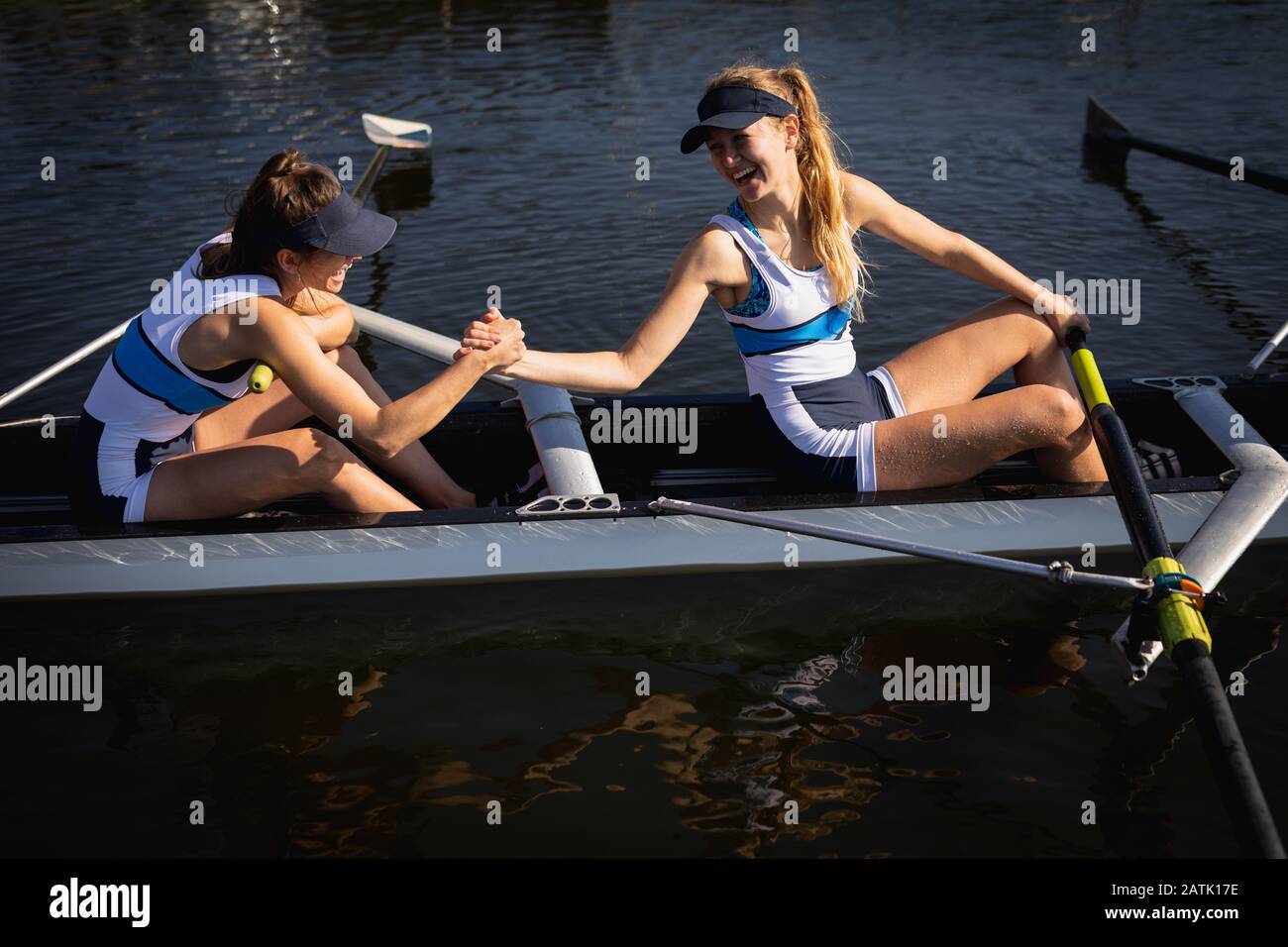 Female rowing team training on a river Stock Photo - Alamy