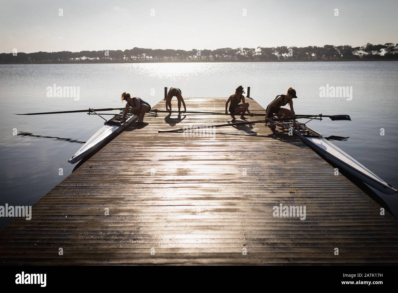 Female rowing team training on a river Stock Photo - Alamy