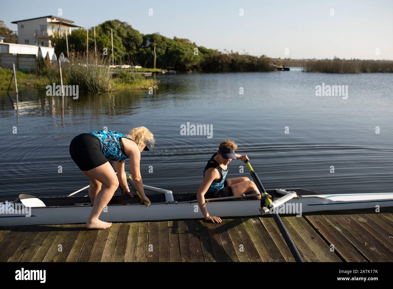 Female rowing team training on a river Stock Photo - Alamy