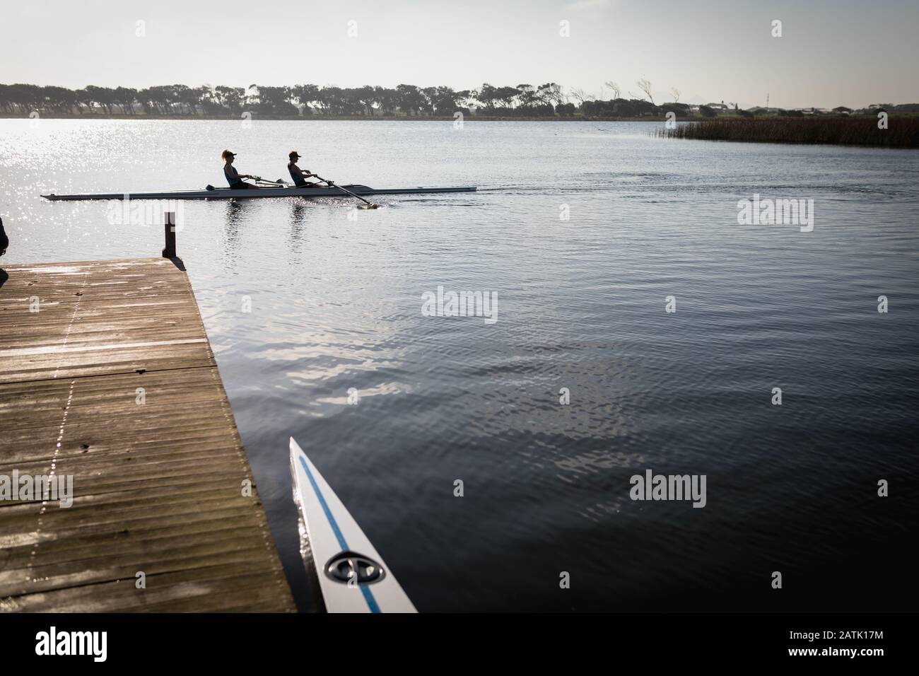 Female rowing team training on a river Stock Photo - Alamy