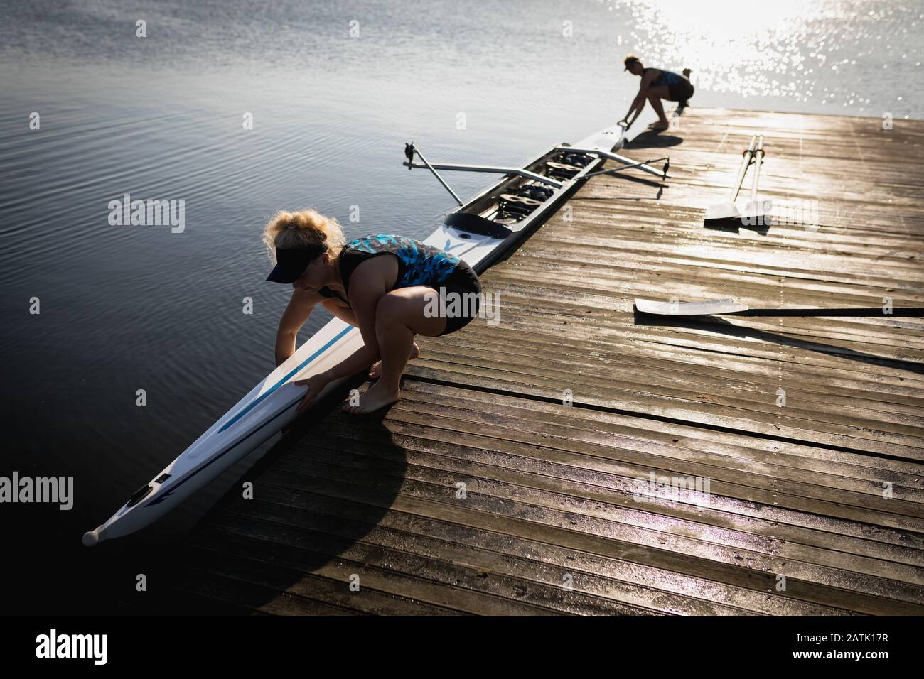 Female rowing team training on a river at the sunset Stock Photo - Alamy