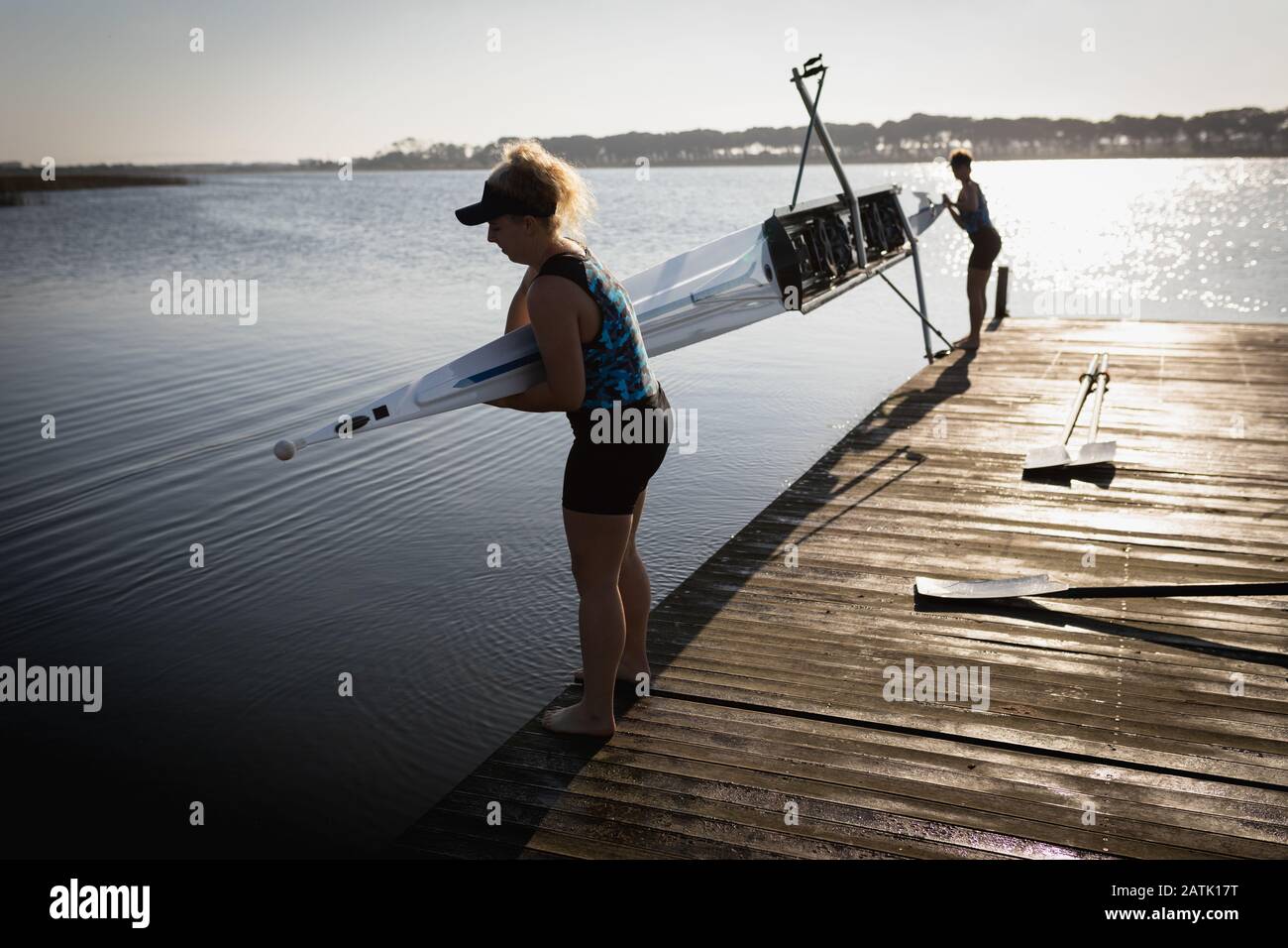 Female rowing team training on a river at the sunset Stock Photo - Alamy