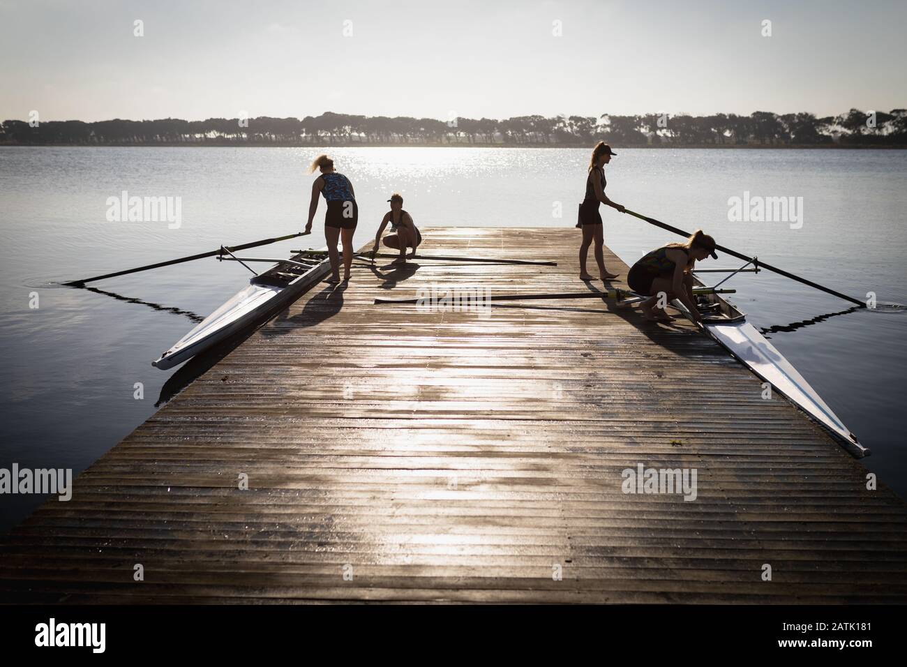 Female rowing team training on a river Stock Photo - Alamy