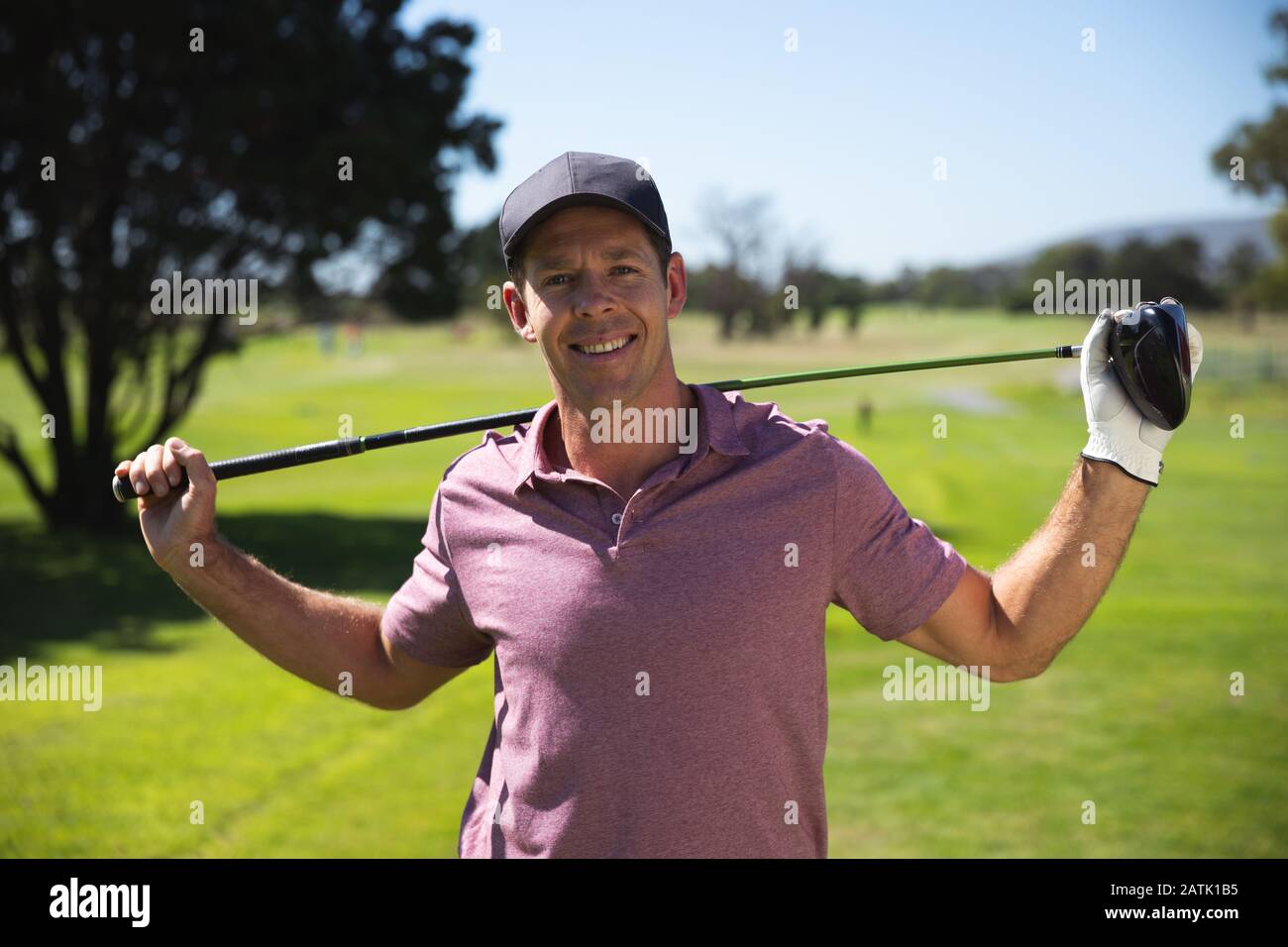 Smiling male golfer holding hi-res stock photography and images - Alamy